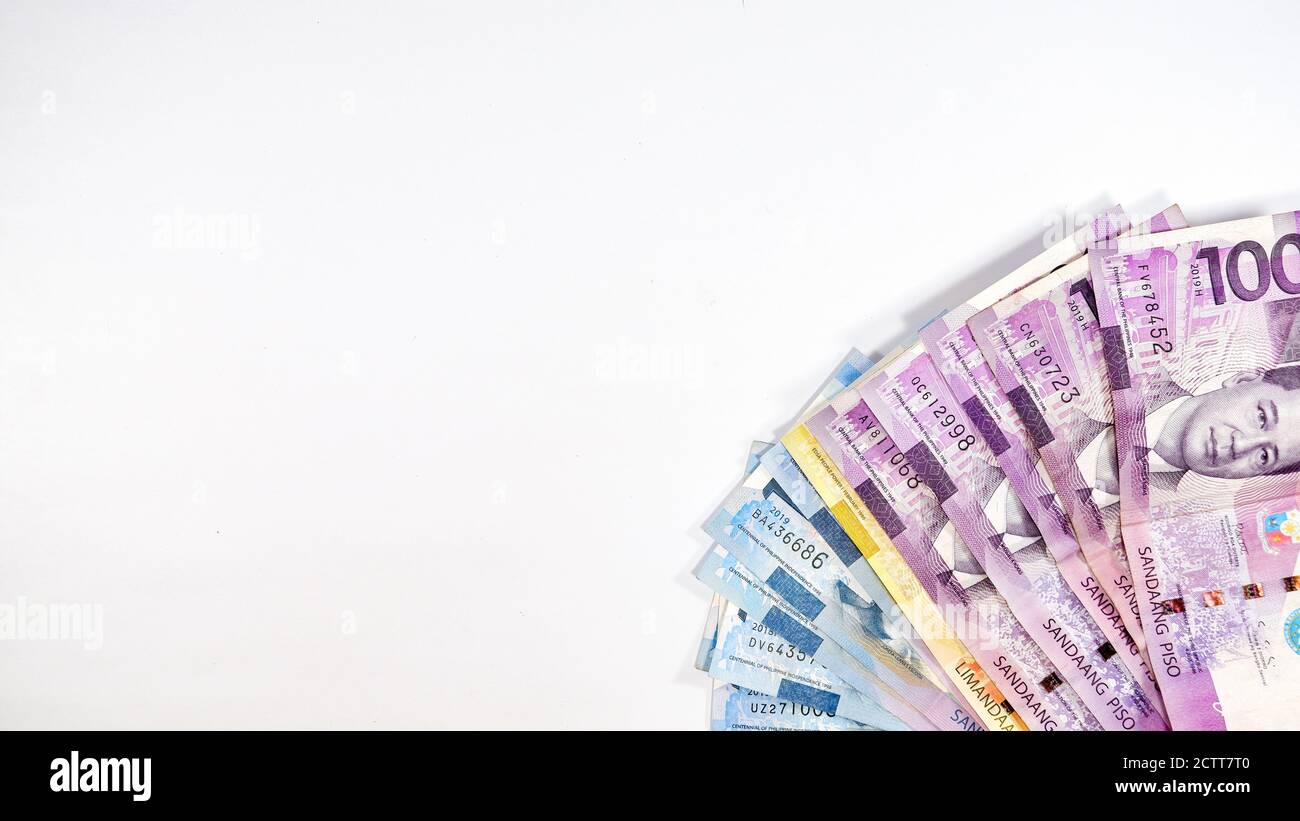 Philippine Peso Bills on white background Stock Photo - Alamy