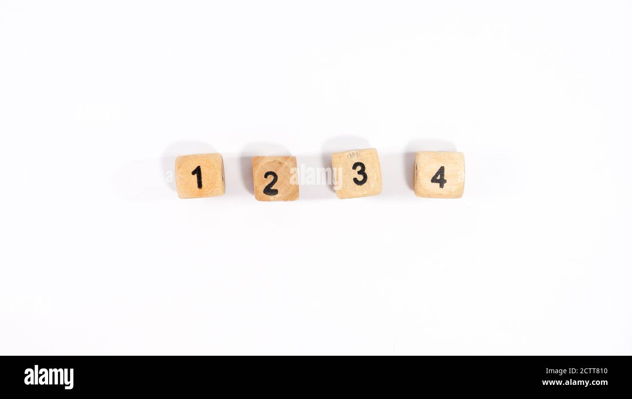 Four wooden dice on white background Stock Photo - Alamy
