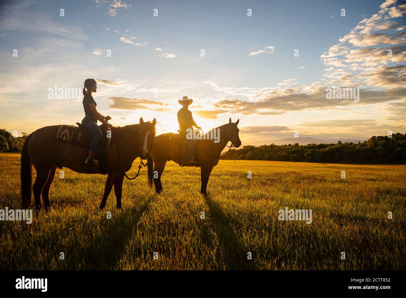 Father and daughter horseback riding hi-res stock photography and ...