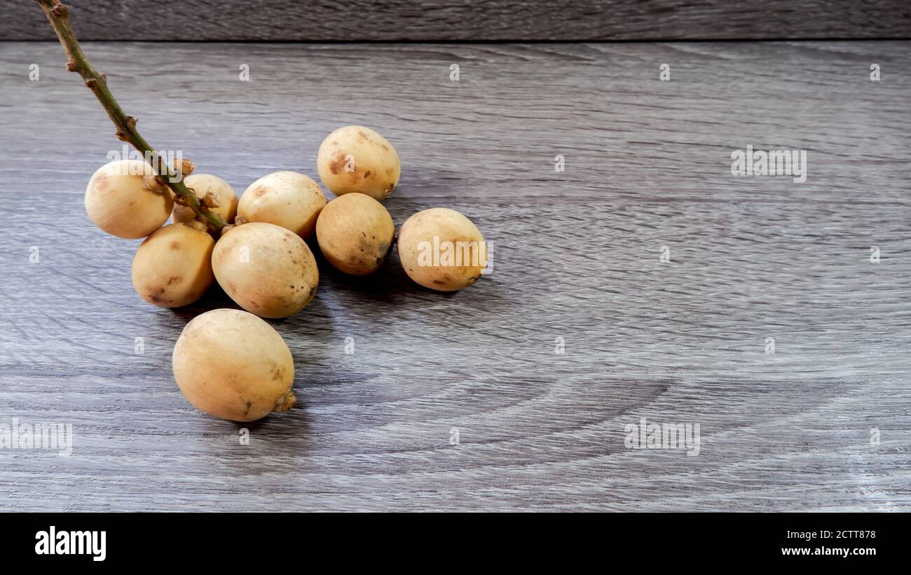 Stem of Lanzones fruit on white background Stock Photo - Alamy