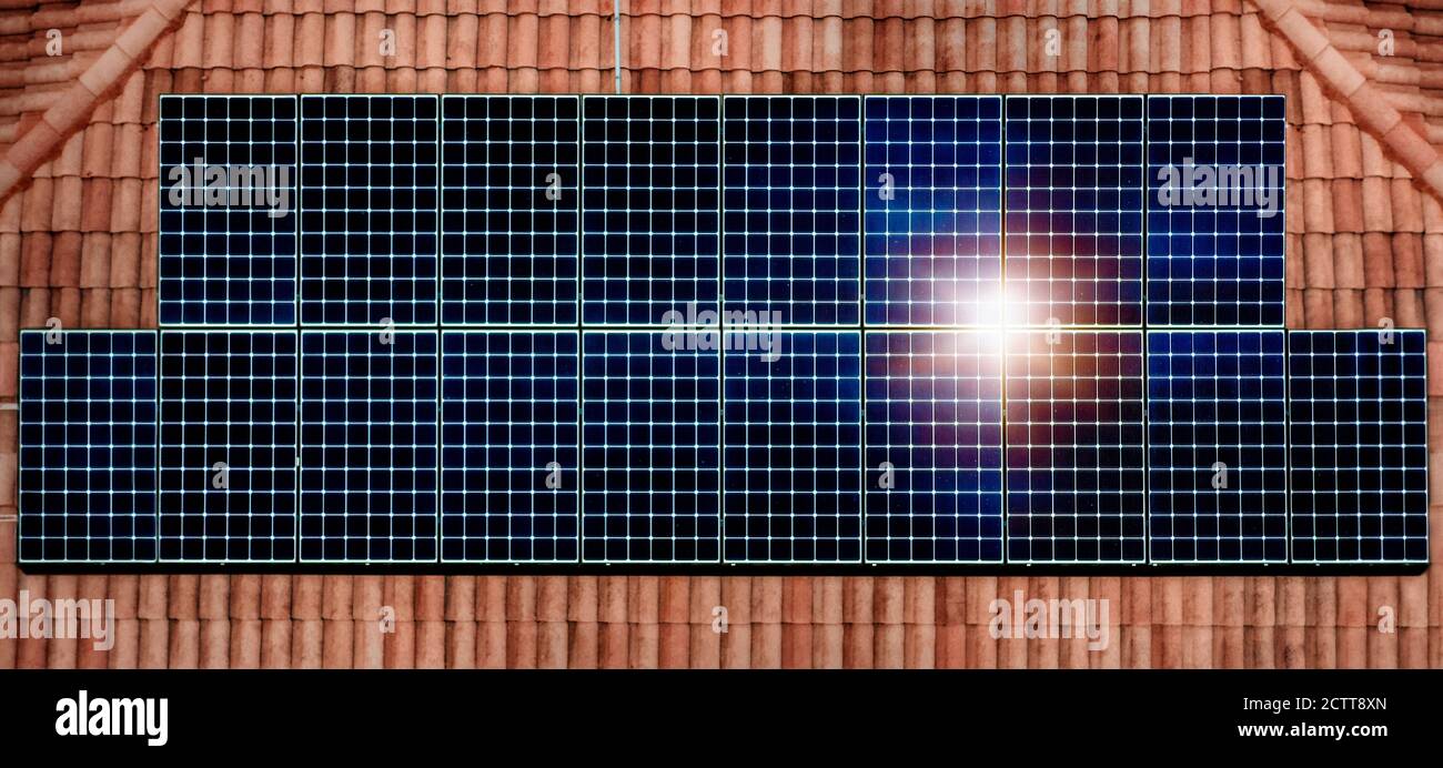 Solar panels reflecting sun on house roof Stock Photo - Alamy