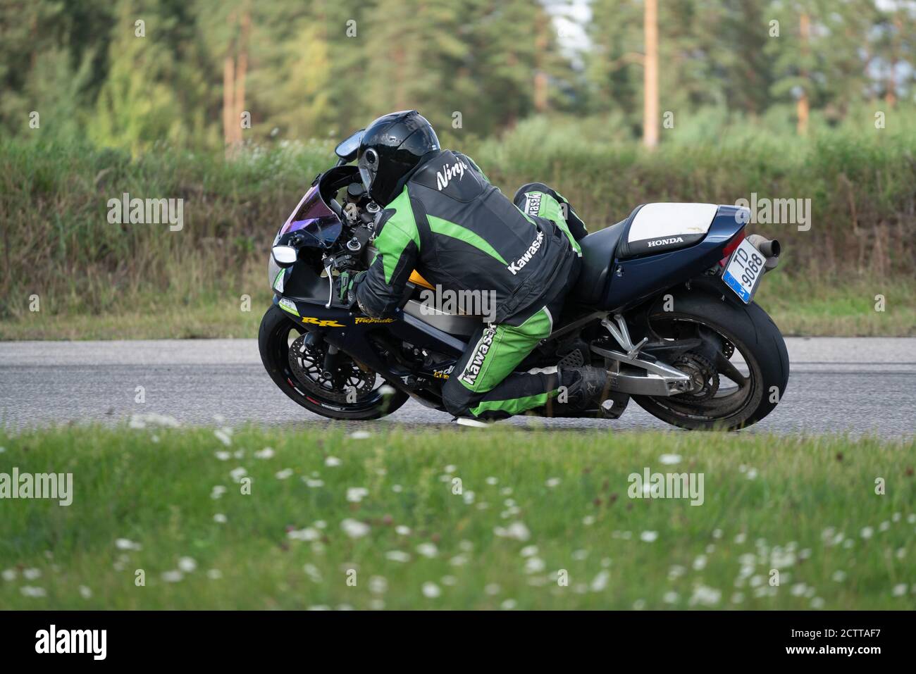 05-09-2020 Riga, Latvia Man on a motorbike on the road riding. having ...