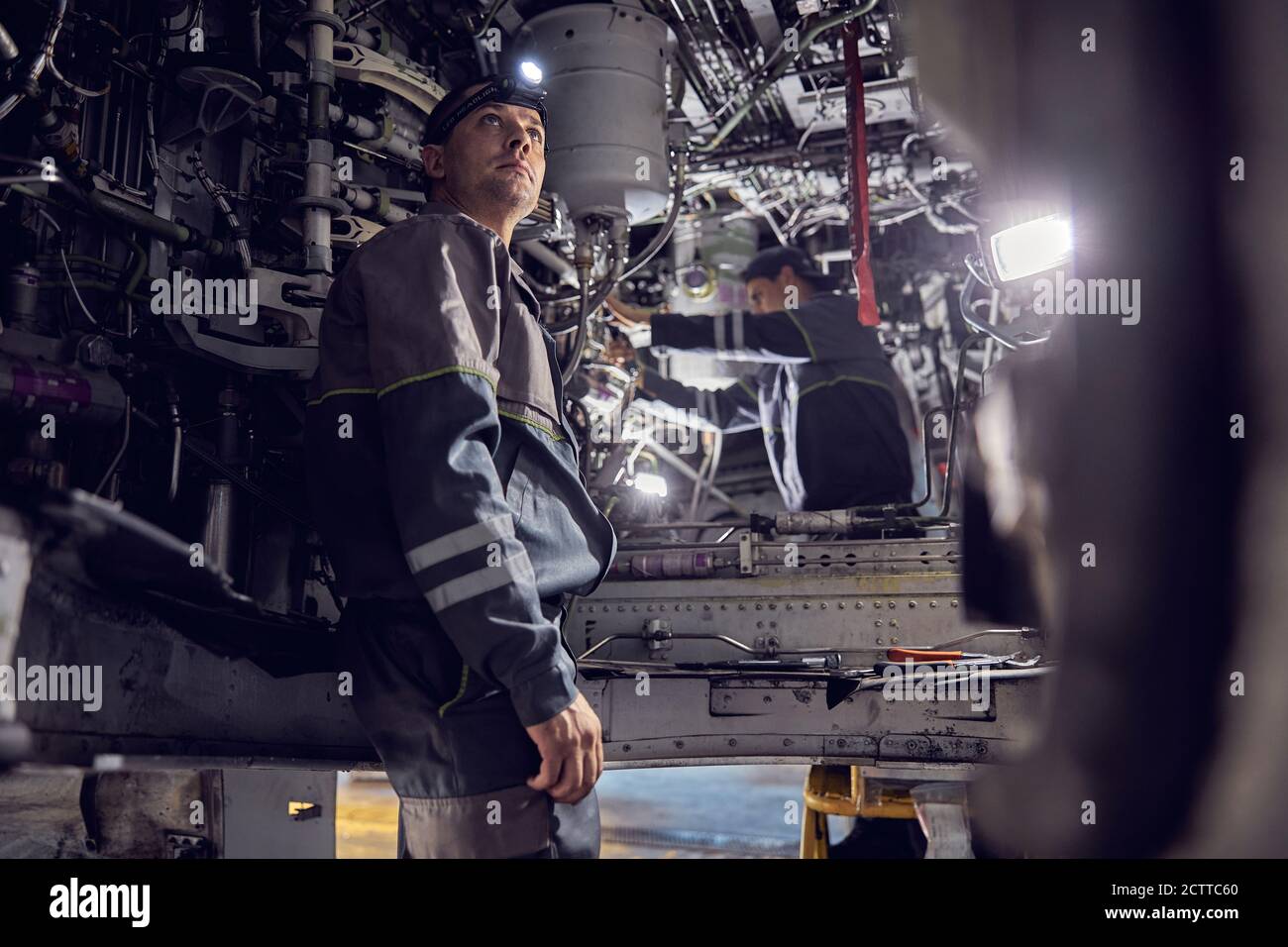 Aviation mechanic working on airplane hi-res stock photography and ...