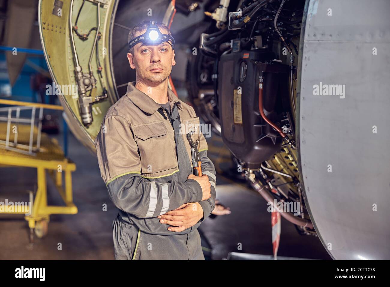 Man with jet turbine in the aviation hangar Stock Photo - Alamy