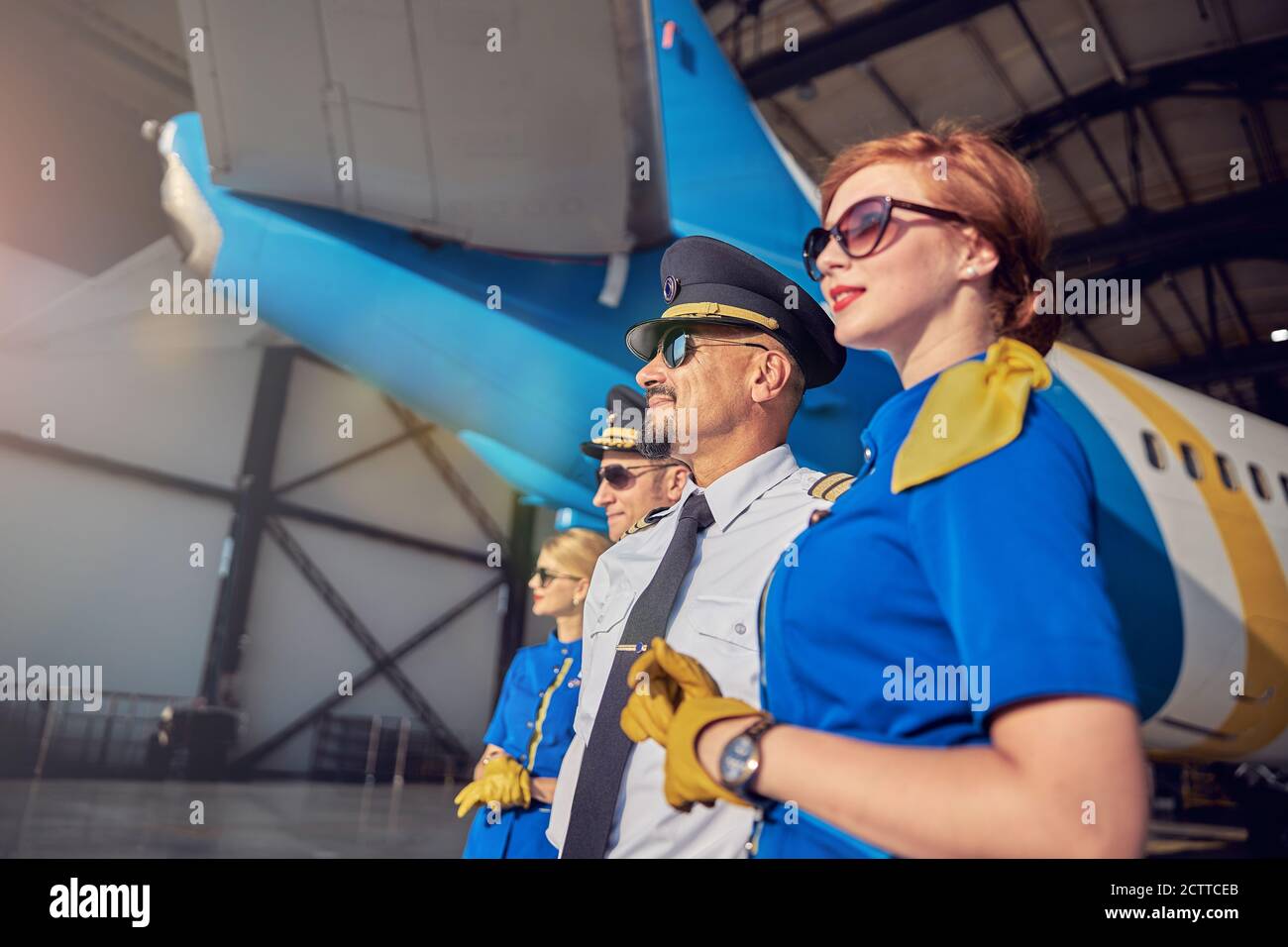 Happy friendly solid team looking to the distance isolated on the big ...