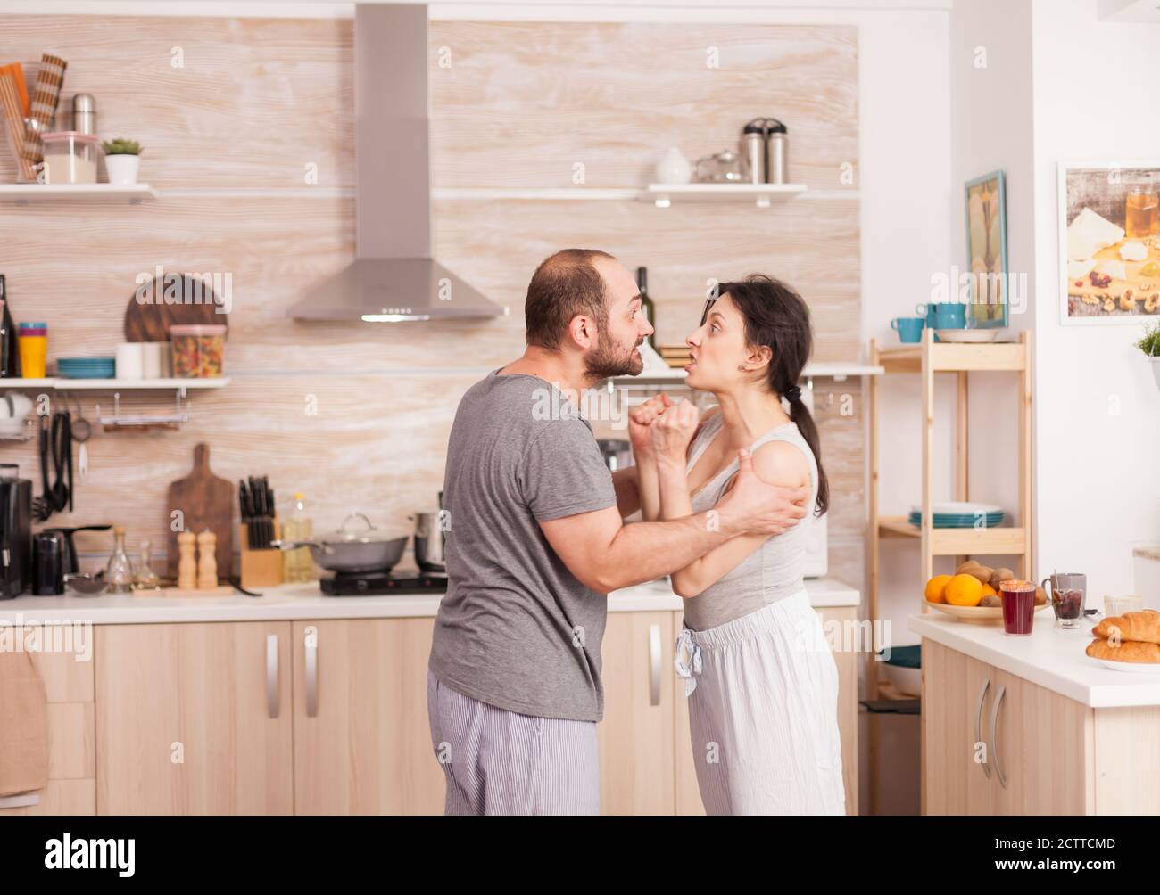 Husband and wife screaming in frustration at each other during ...