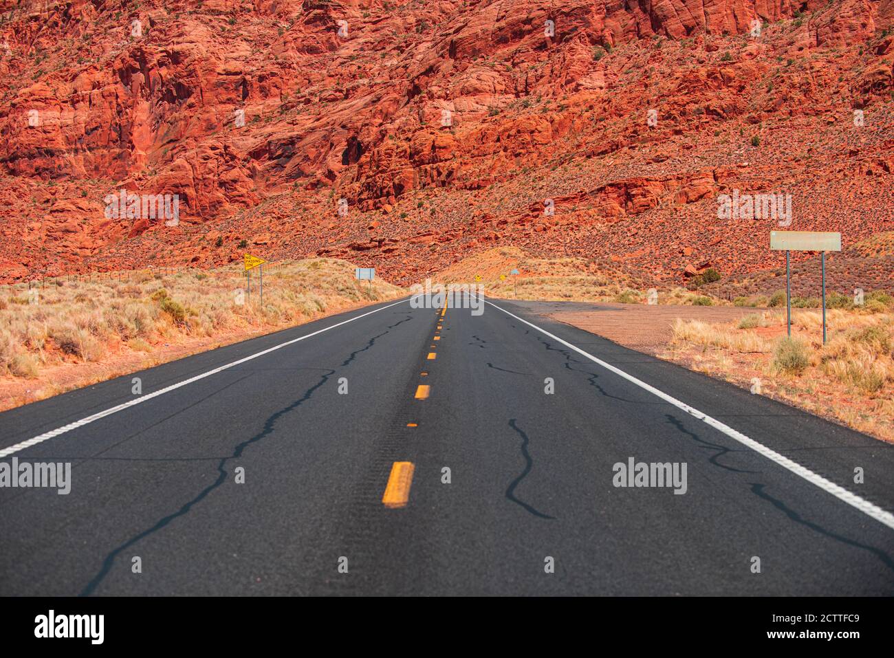Landscape with rocks, sunny sky with clouds and beautiful asphalt road ...