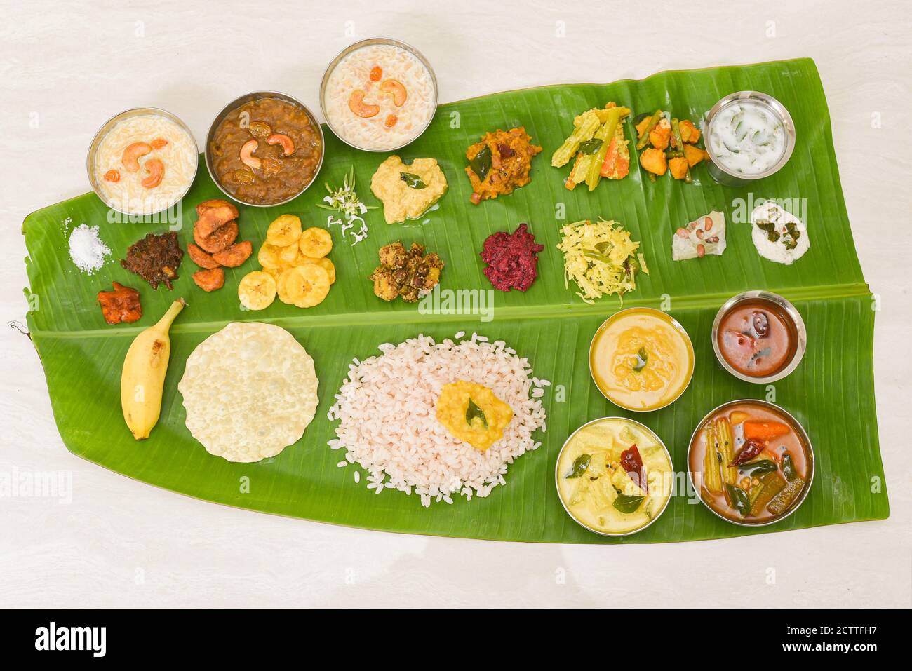 Onam sadhya, Indian women eating with hand boiled rice, served for ...