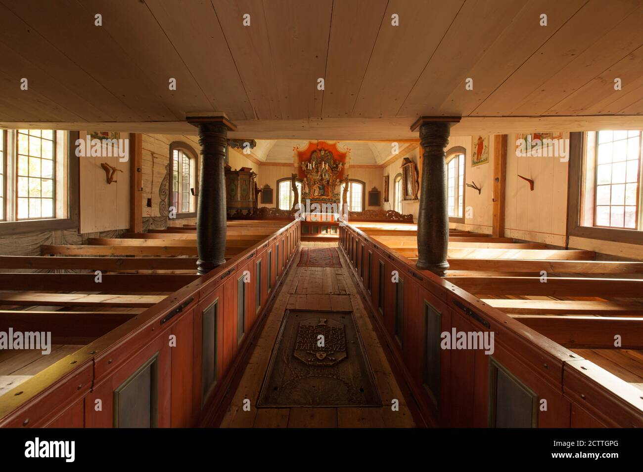 Indoors, interior view of an old wooden church. Altar, passage and ...