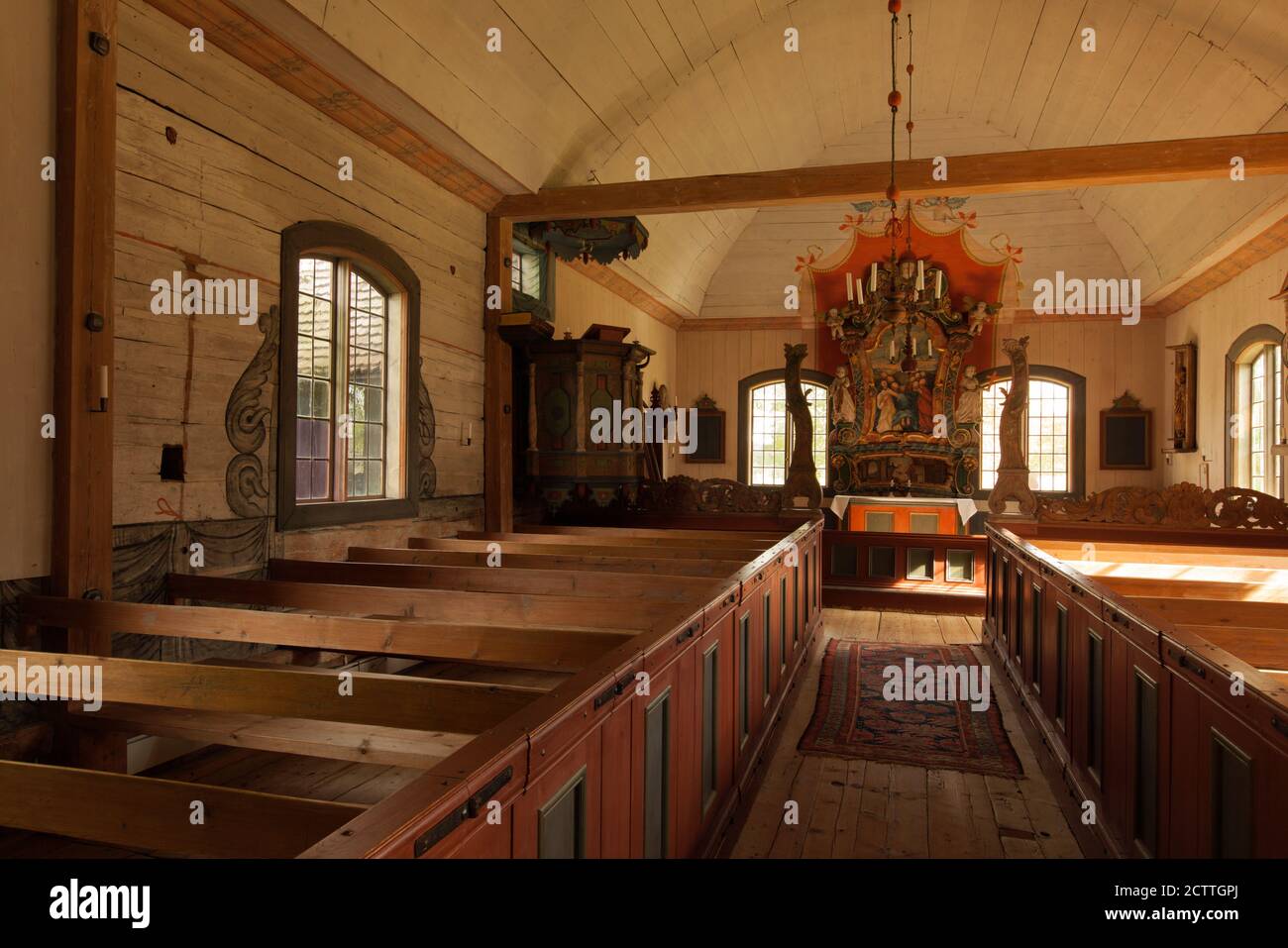 Indoors, interior view of an old wooden church. Altar, passage and ...
