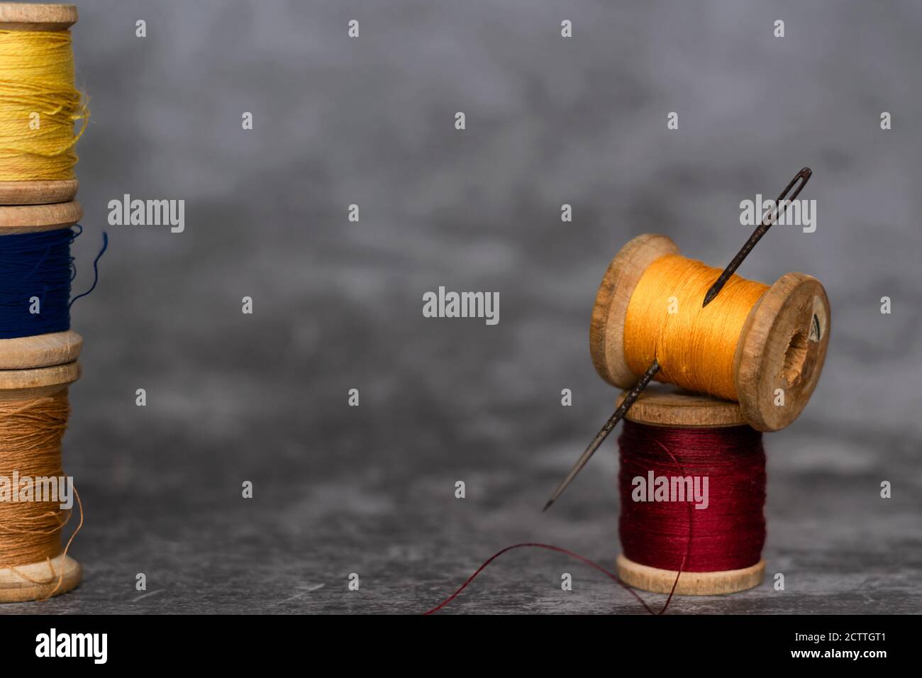 Different colorful cotton mill on grey background Stock Photo - Alamy