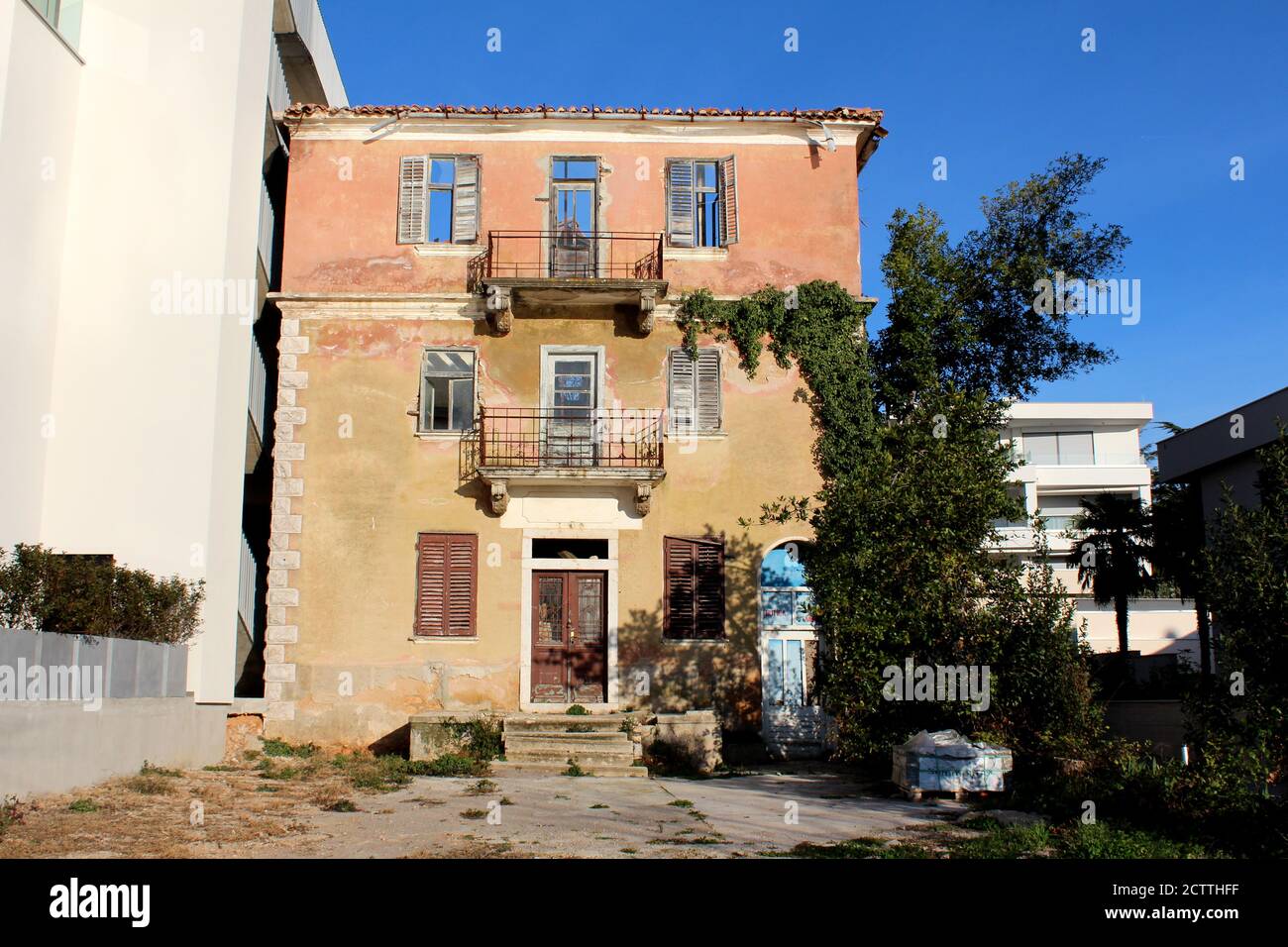 Creepy old abandoned apartment building with broken windows on ...