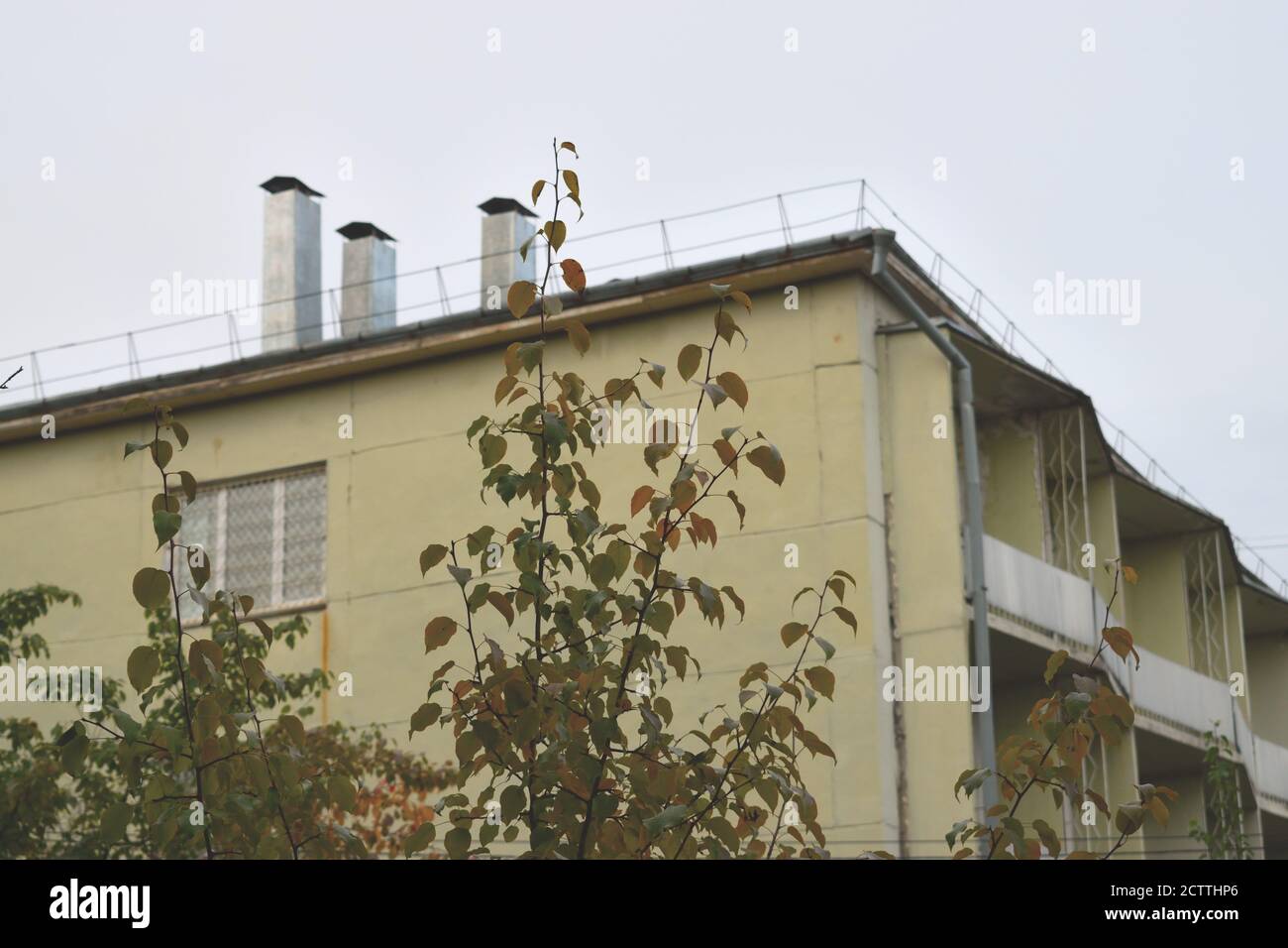 The Top of an Old Faded Yellow Building in Angarsk, Russia Stock Photo ...