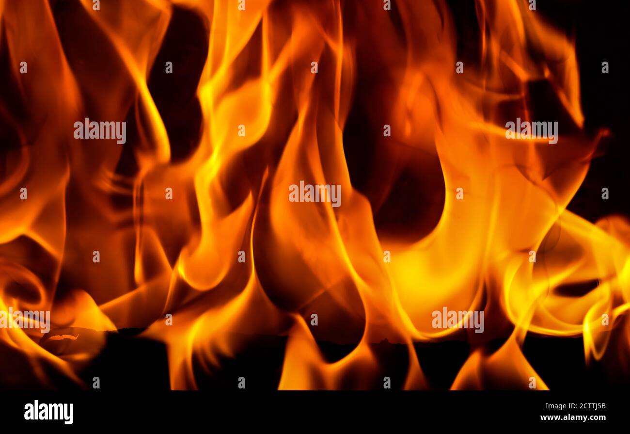 Red blaze Fire flame on a black background Stock Photo - Alamy