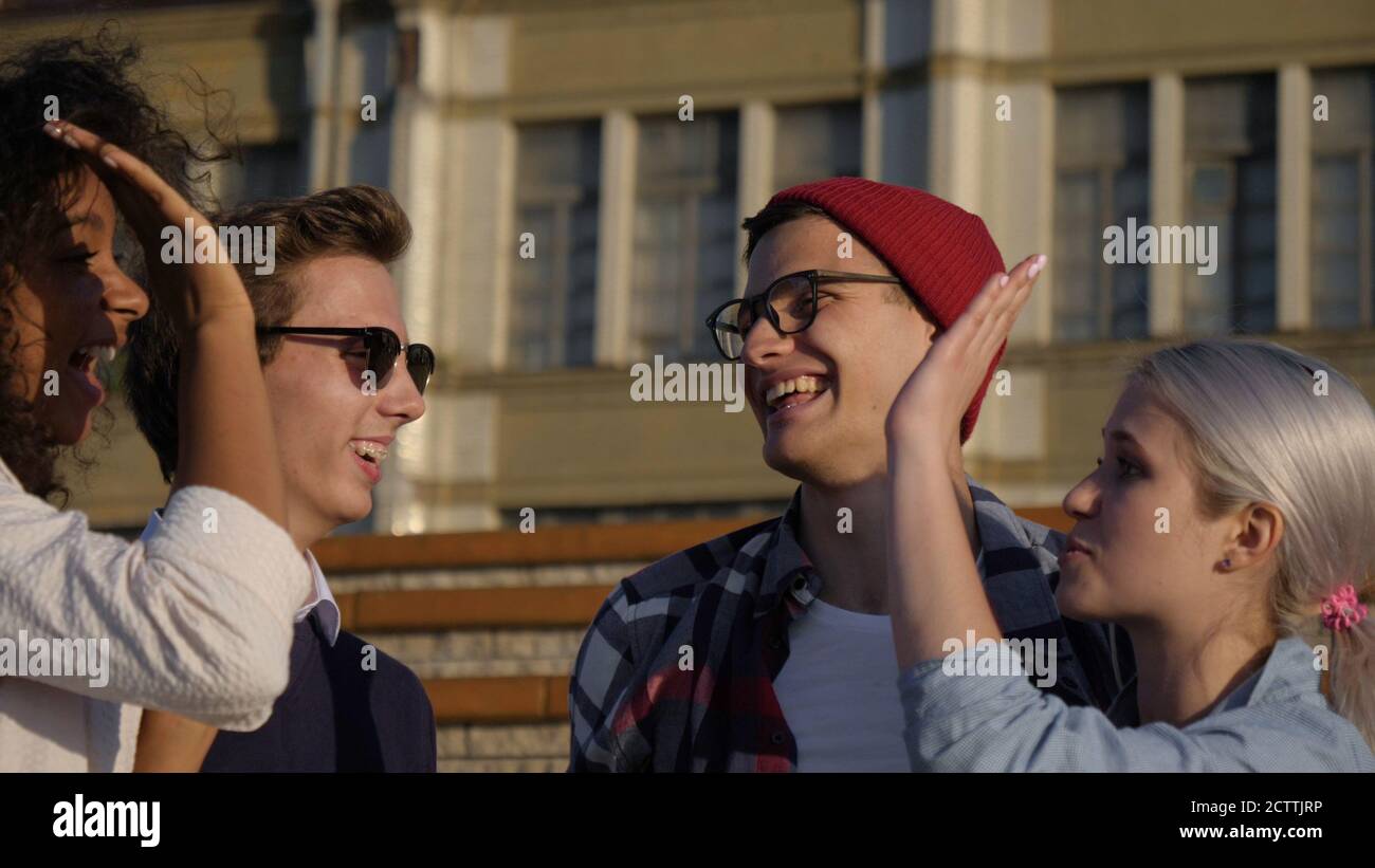 Happy students rejoice at the performance of work Stock Photo - Alamy