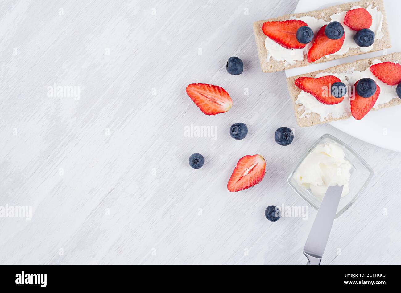 Healthy dietary breakfast of crisps rye flat toast with fresh ripe ...
