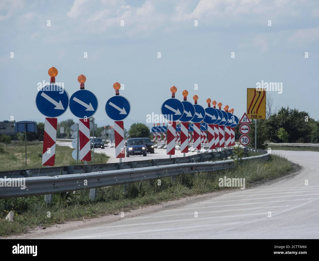 Direction sign with arrow showing the way in road traffic Stock Photo ...