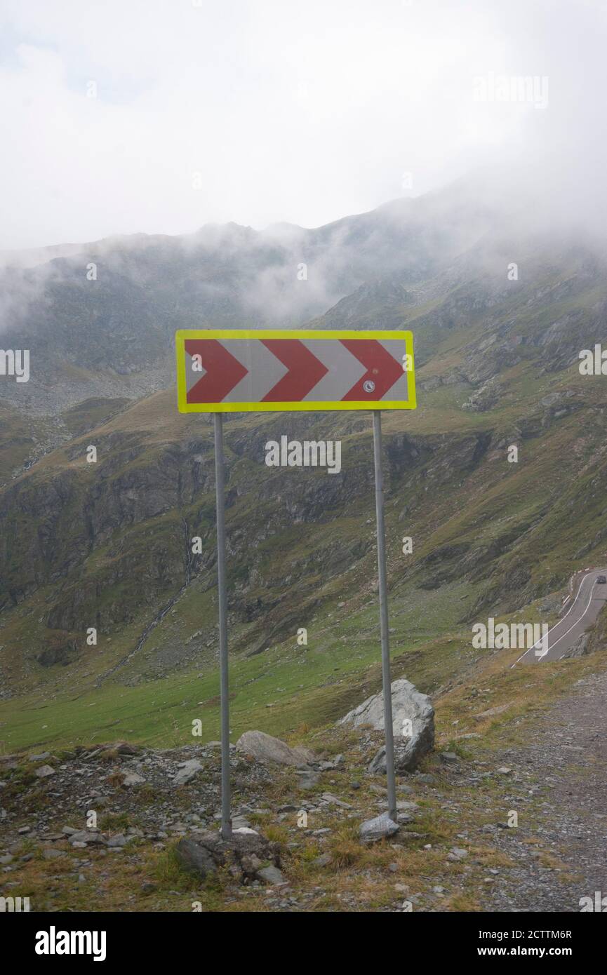 Direction sign with arrow showing the way in road traffic Stock Photo ...