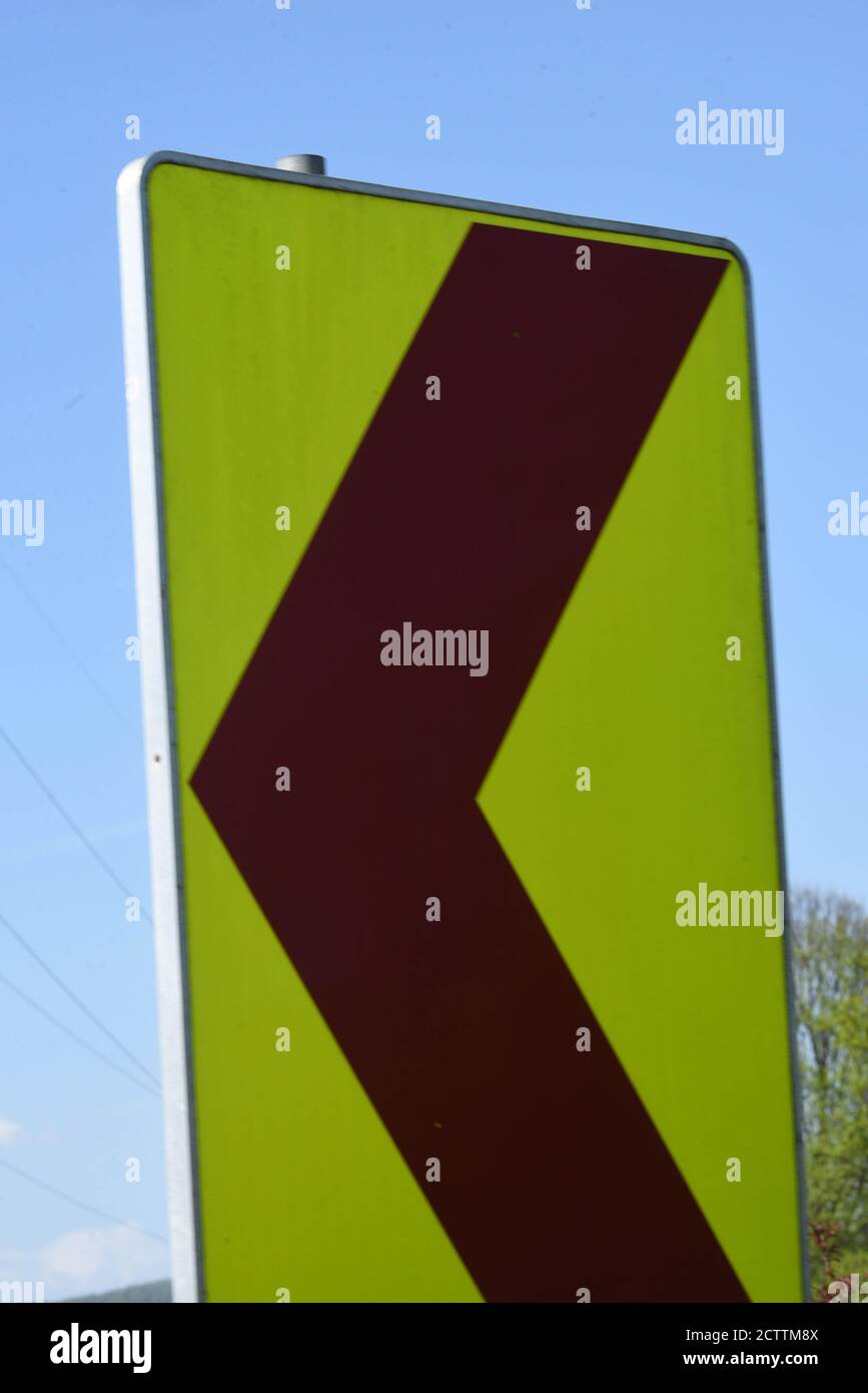 Direction sign with arrow showing the way in road traffic Stock Photo ...