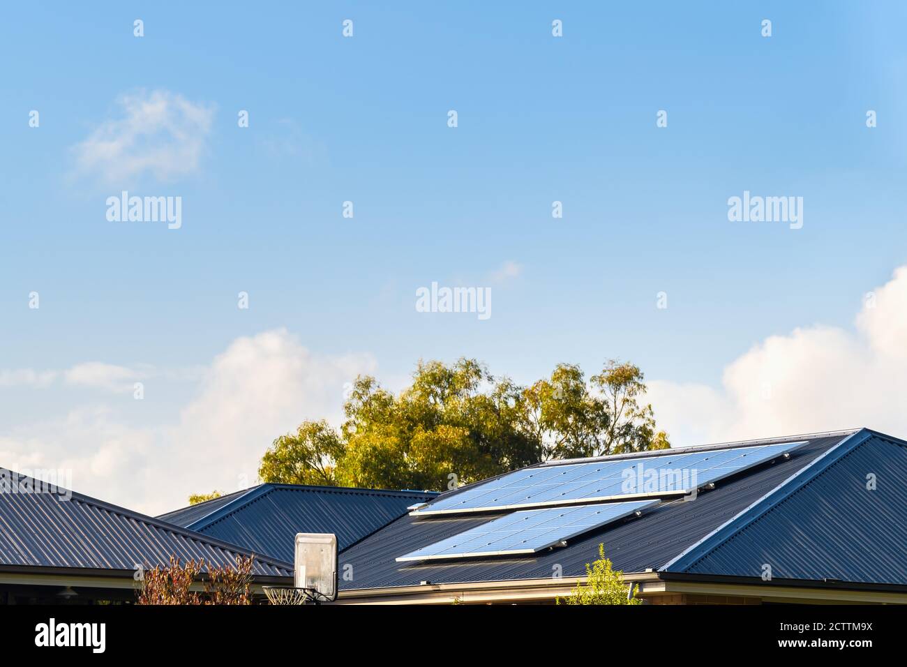 New solar panels installed on metal sheet roof of the house in South ...