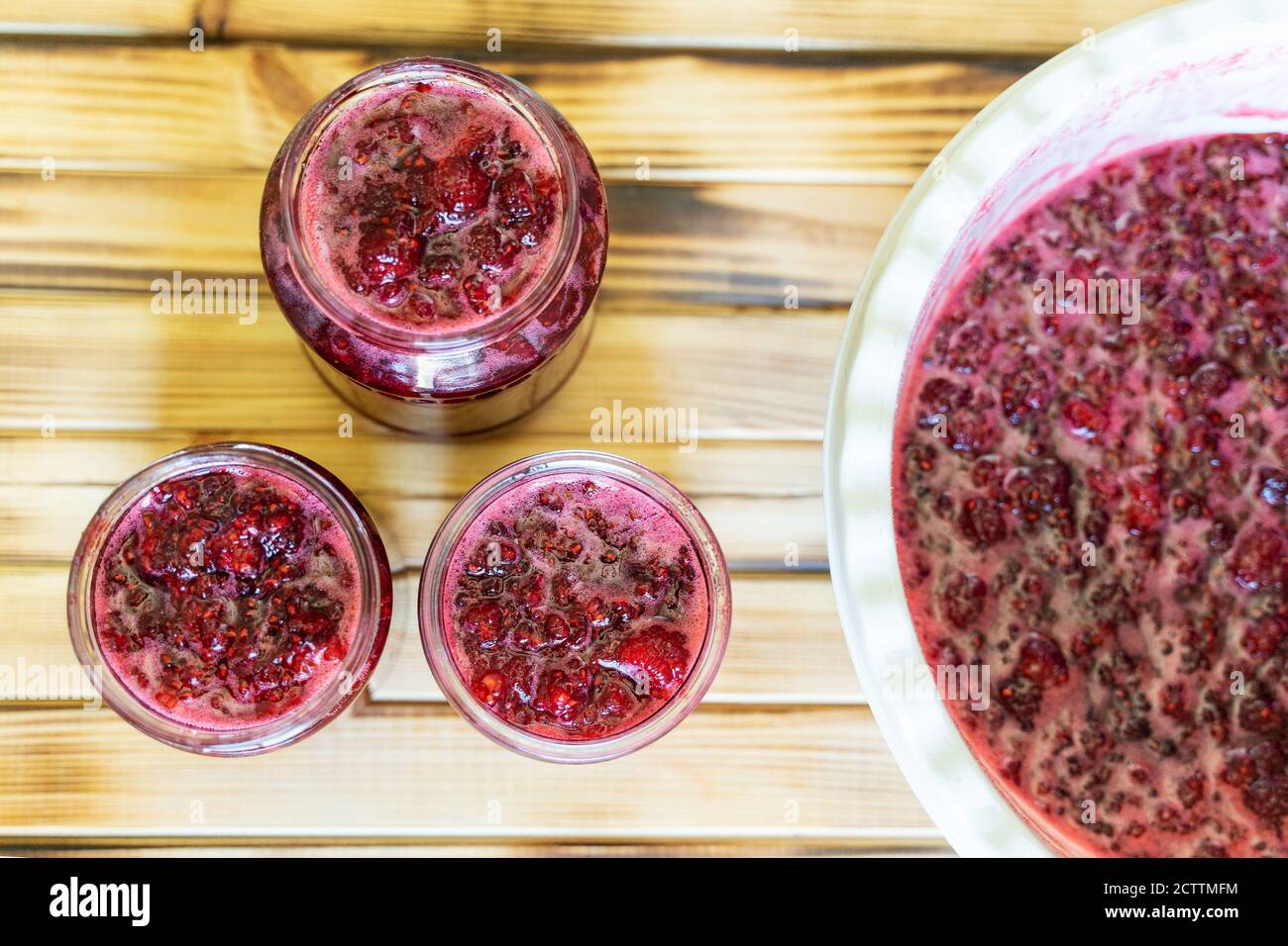 preparation of raspberries ground with sugar for the winter is ready ...