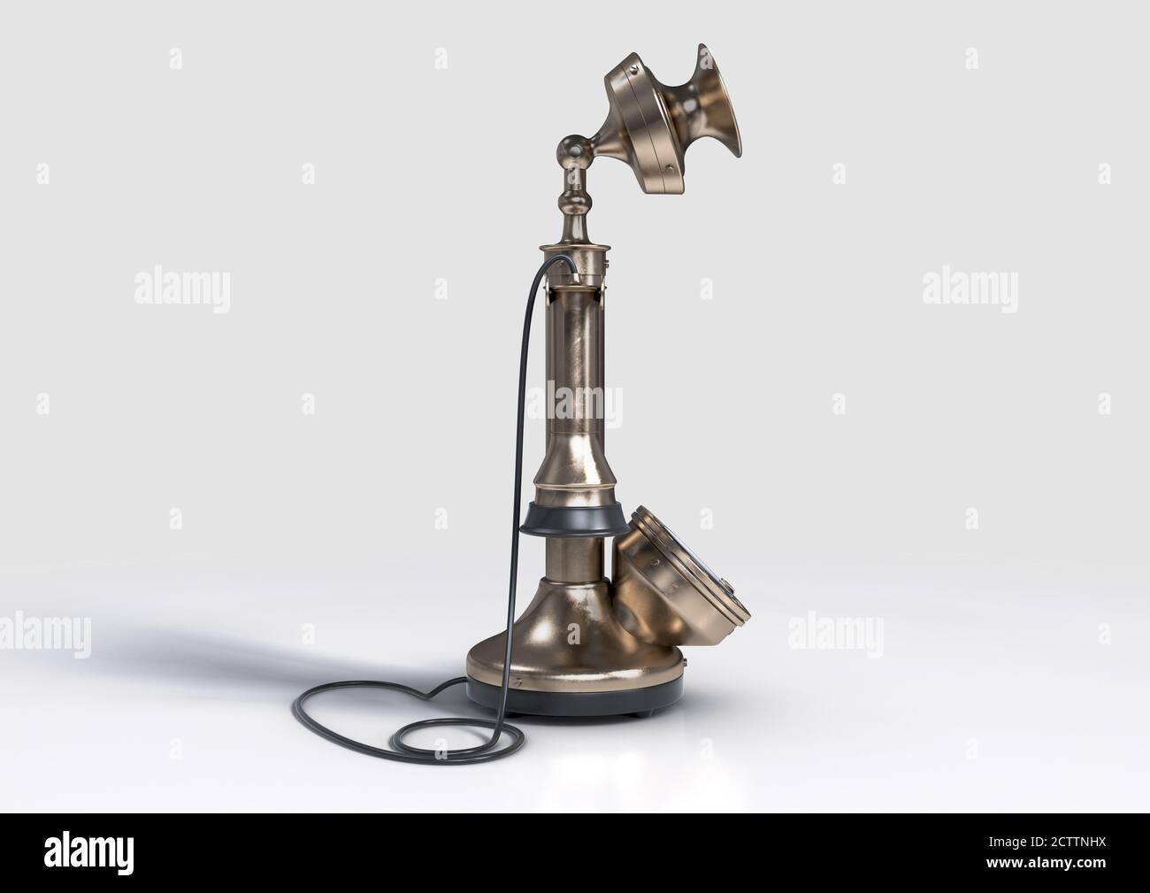 A vintage retro candlestick bell telephone made of brass on an isolated ...