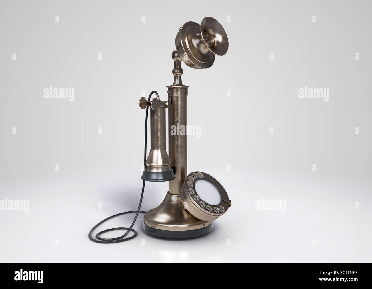 A vintage retro candlestick bell telephone made of brass on an isolated ...