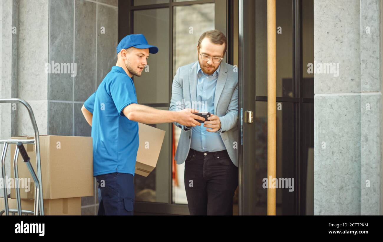 Delivery Man Gives Postal Package to a Business Customer, Who Signs ...