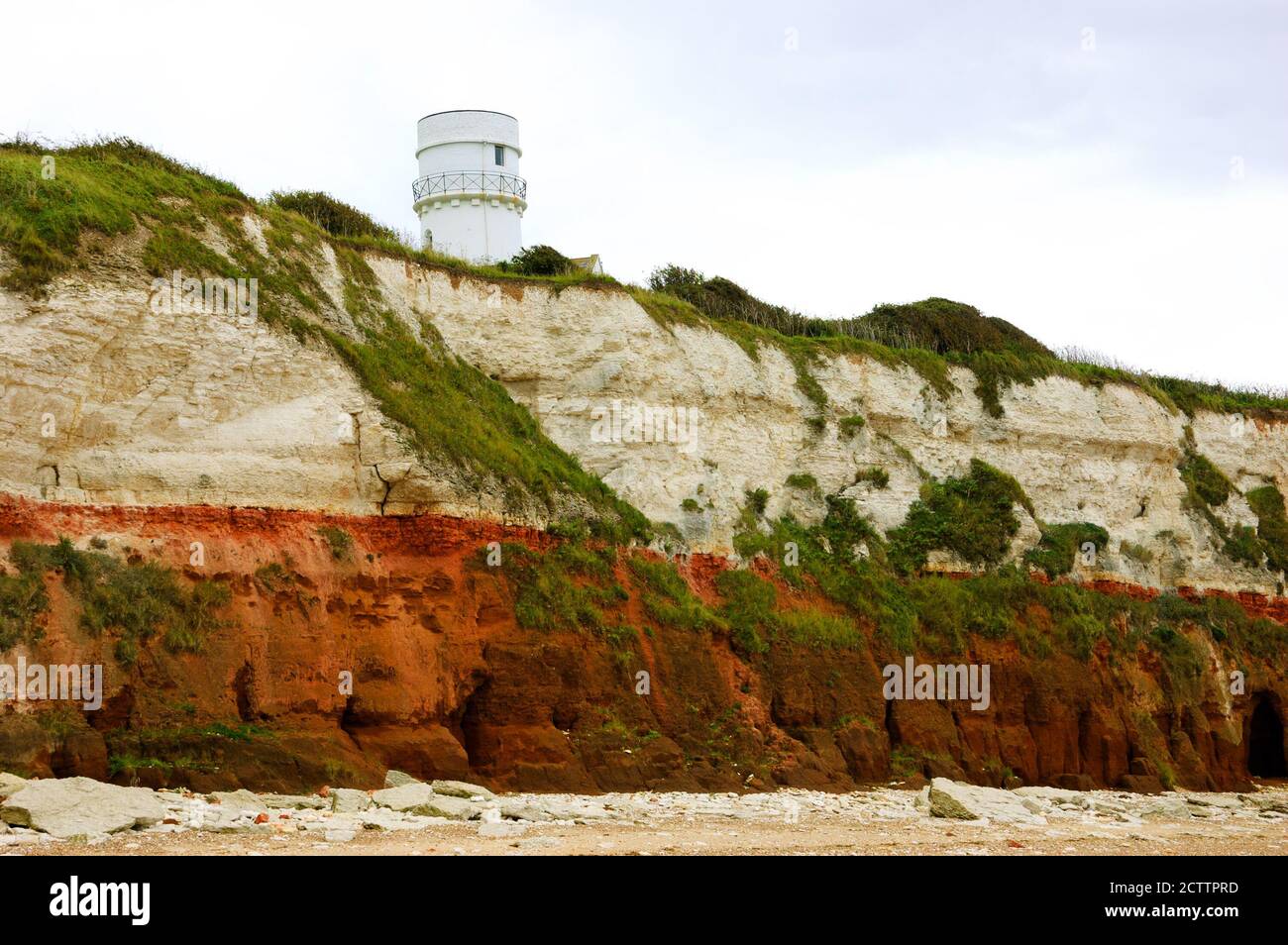 Lighthouse over Hunstanton cliffs (famous red and white striped cliffs ...