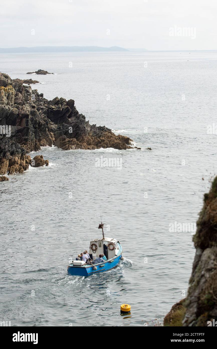 Boat excursion leaving Polperro Bay heading towards the English Channel ...