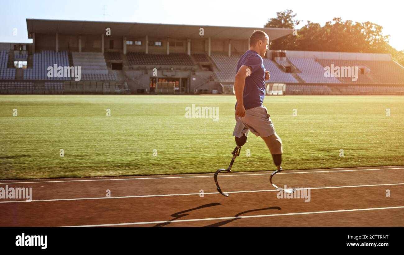 Athletic Disabled Fit Man with Prosthetic Running Blades is Training on ...