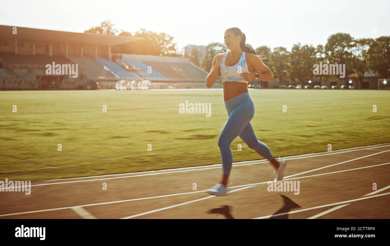 Beautiful Fitness Girl in Light Blue Athletic Top and Leggings Jogging ...
