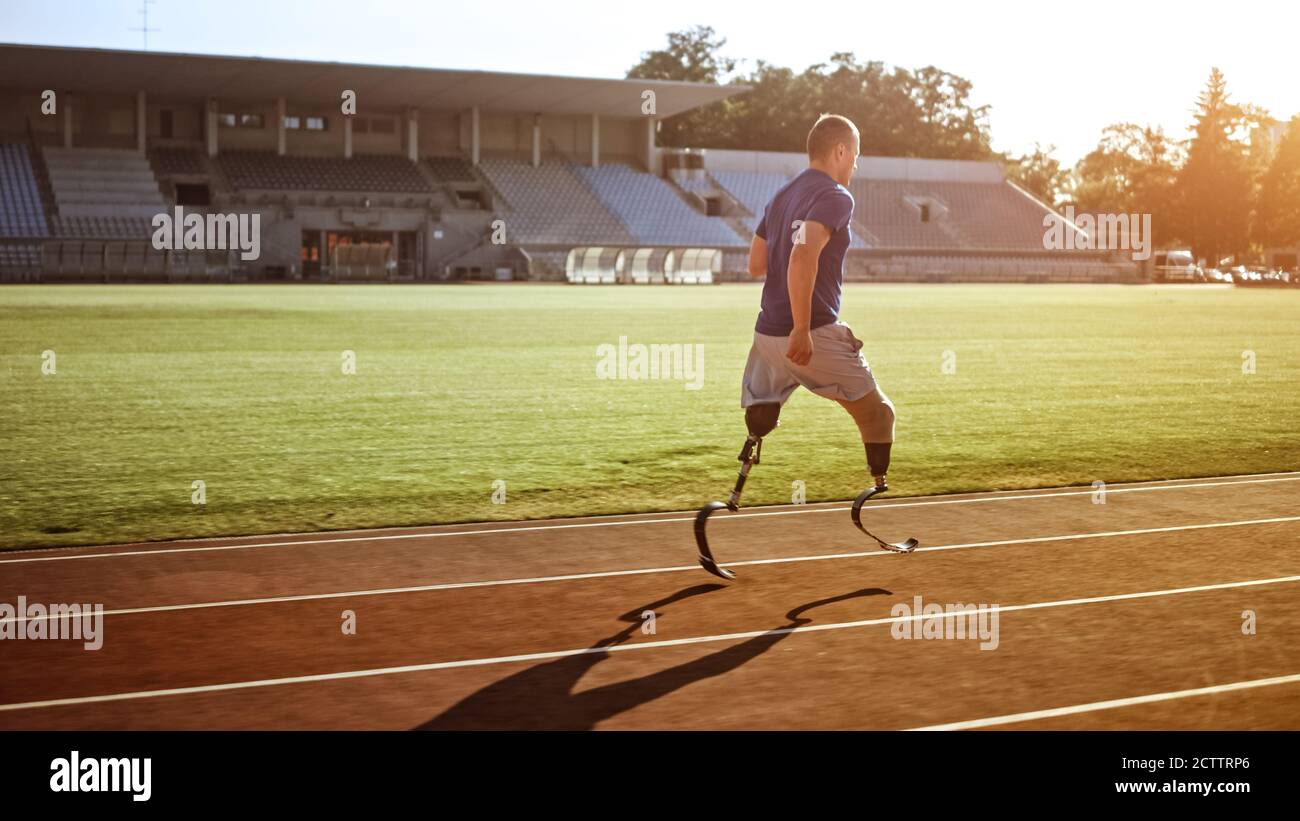 Athletic Disabled Fit Man with Prosthetic Running Blades is Training on ...