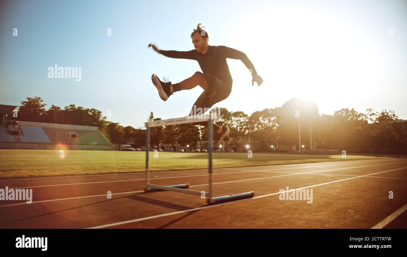 Athlete jump over barrier hi-res stock photography and images - Alamy