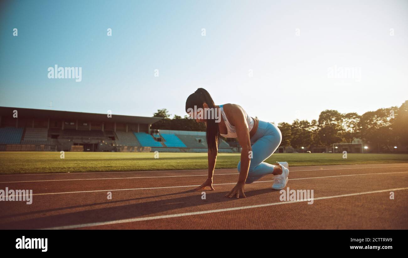 Beautiful Fitness Woman in Light Blue Athletic Top and Leggings is ...