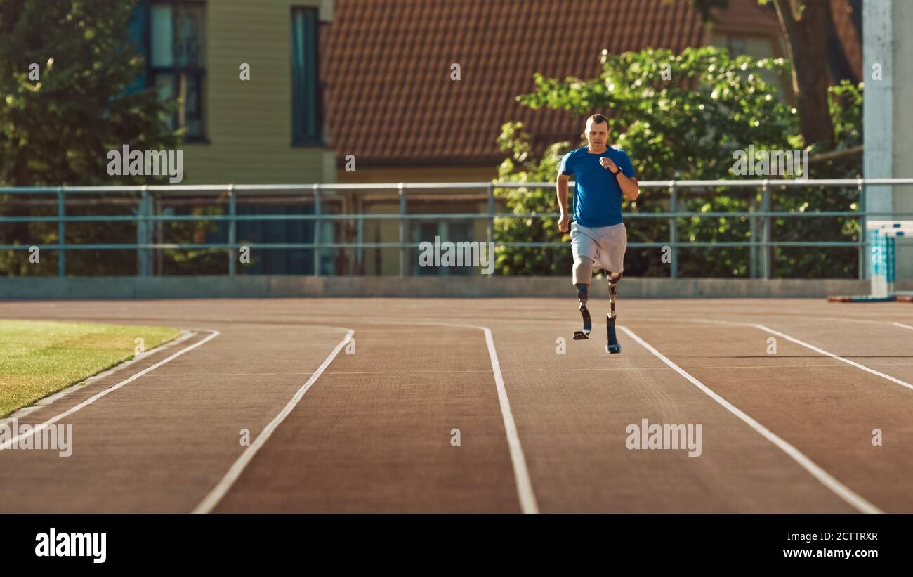 Athletic Disabled Fit Man with Prosthetic Running Blades is Training on ...