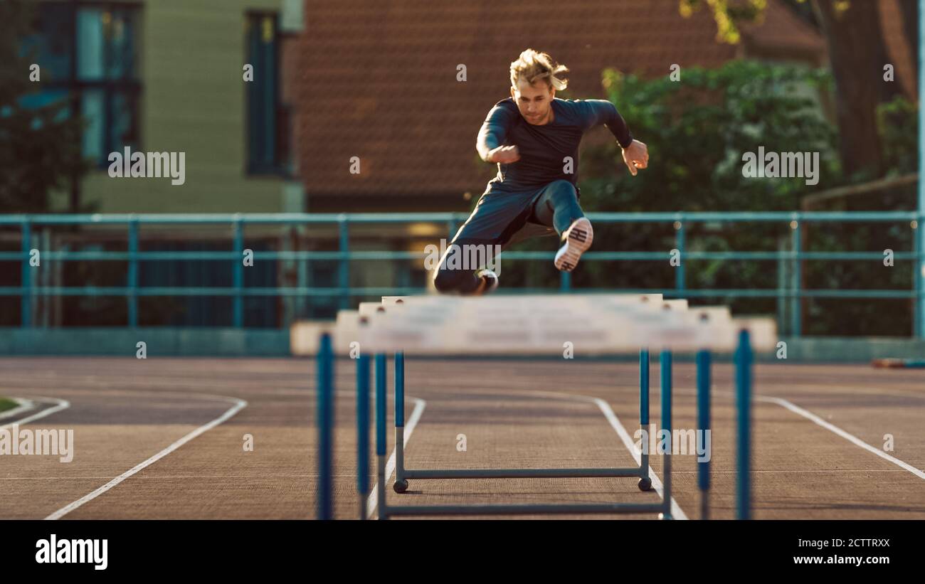 Athlete jump over barrier hi-res stock photography and images - Alamy