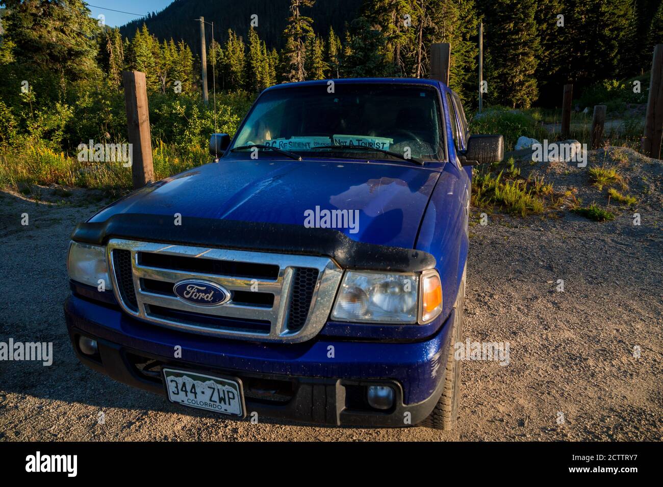 Car with a foreign licence plate displays a sign indicating the owner ...