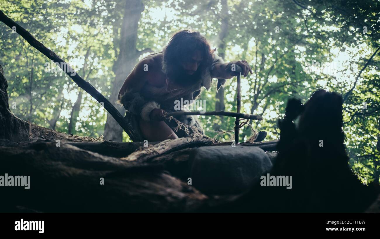 Prehistoric man fire animal hi-res stock photography and images - Alamy