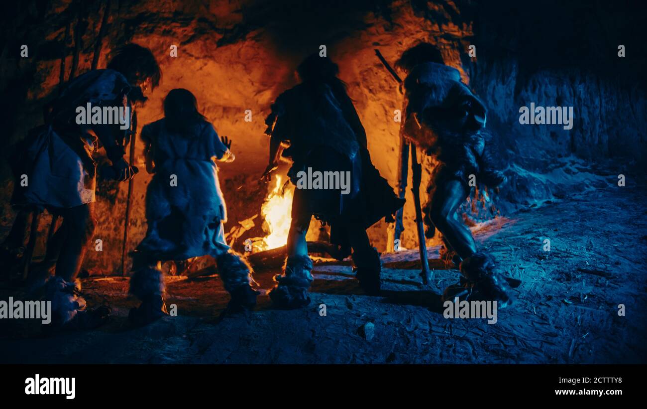 Tribe of Prehistoric Hunter-Gatherers Wearing Animal Skins Dance Around ...