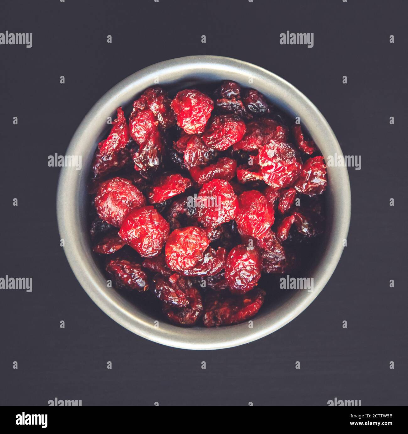 Cranberries in a bowl on a kitchen table. Top view Stock Photo - Alamy