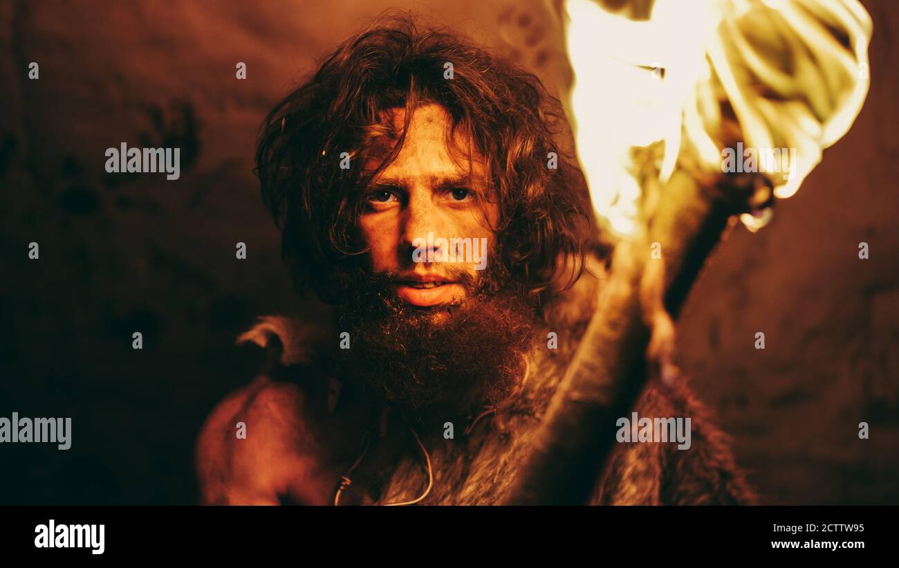 Portrait of Primeval Caveman Wearing Animal Skin Standing in His Cave ...