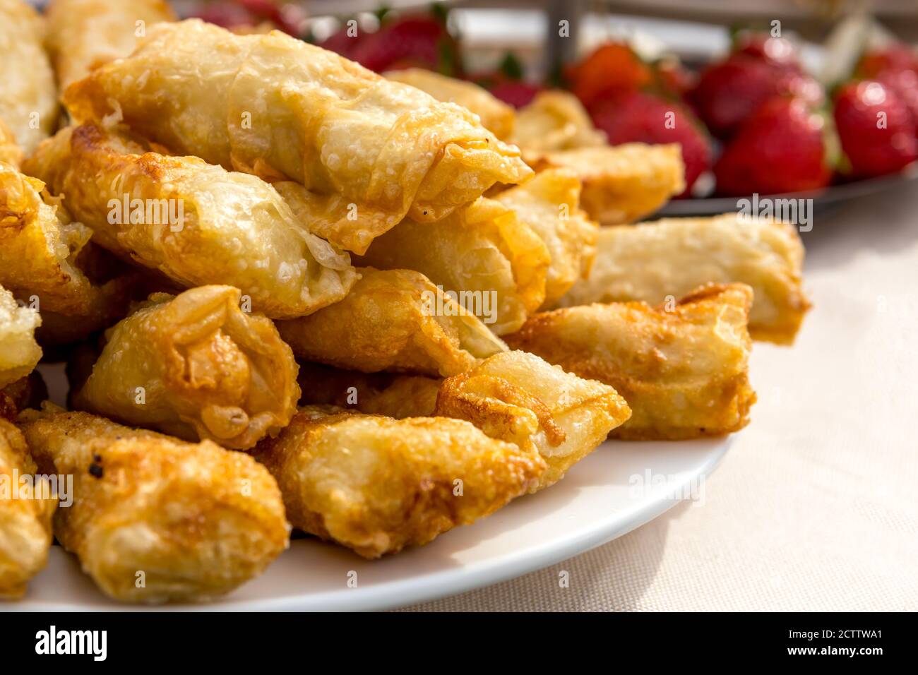 Fresh baked goods lying on a white plate close up Stock Photo - Alamy