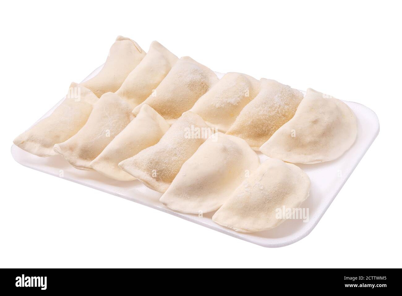 Frozen dumplings in a tray in rows on a white isolated background Stock ...