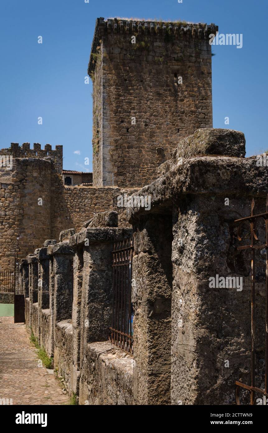 The main tower of Miranda Castle stands behind the stone wall in a day ...