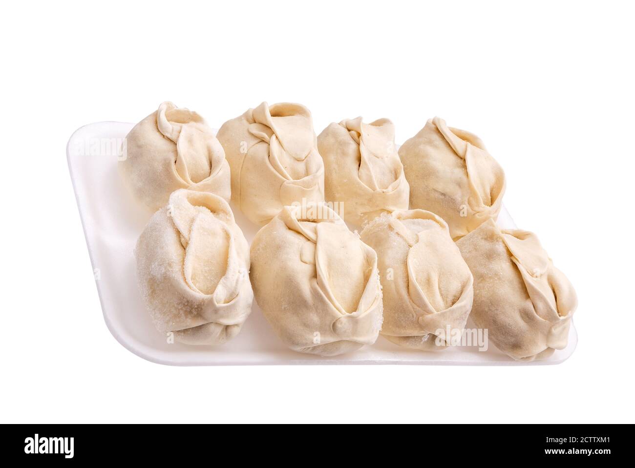 Frozen dumplings in a tray in rows on a white isolated background Stock ...