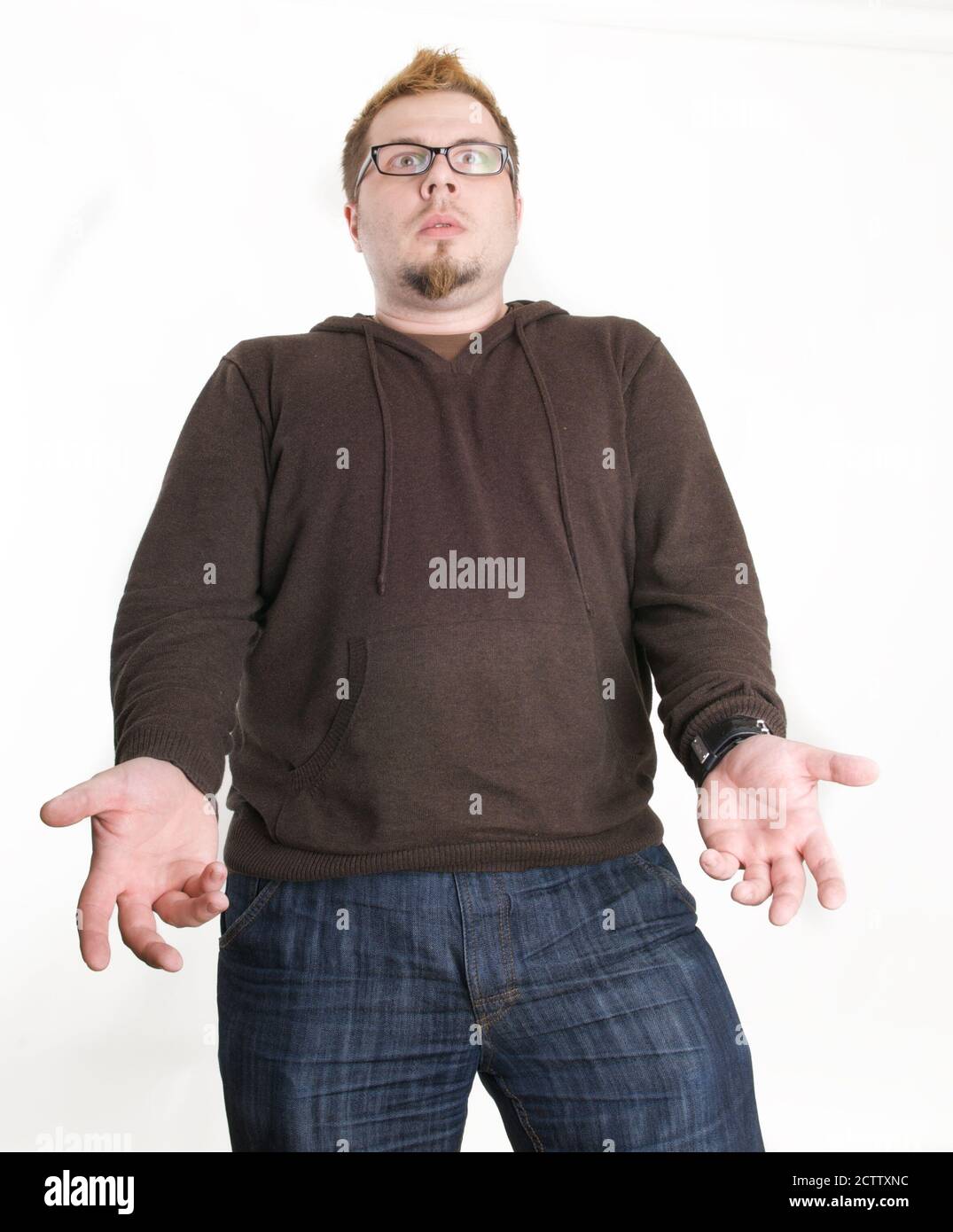 Perplexed Man with Glasses and Brown Sweatshirt Stock Photo - Alamy