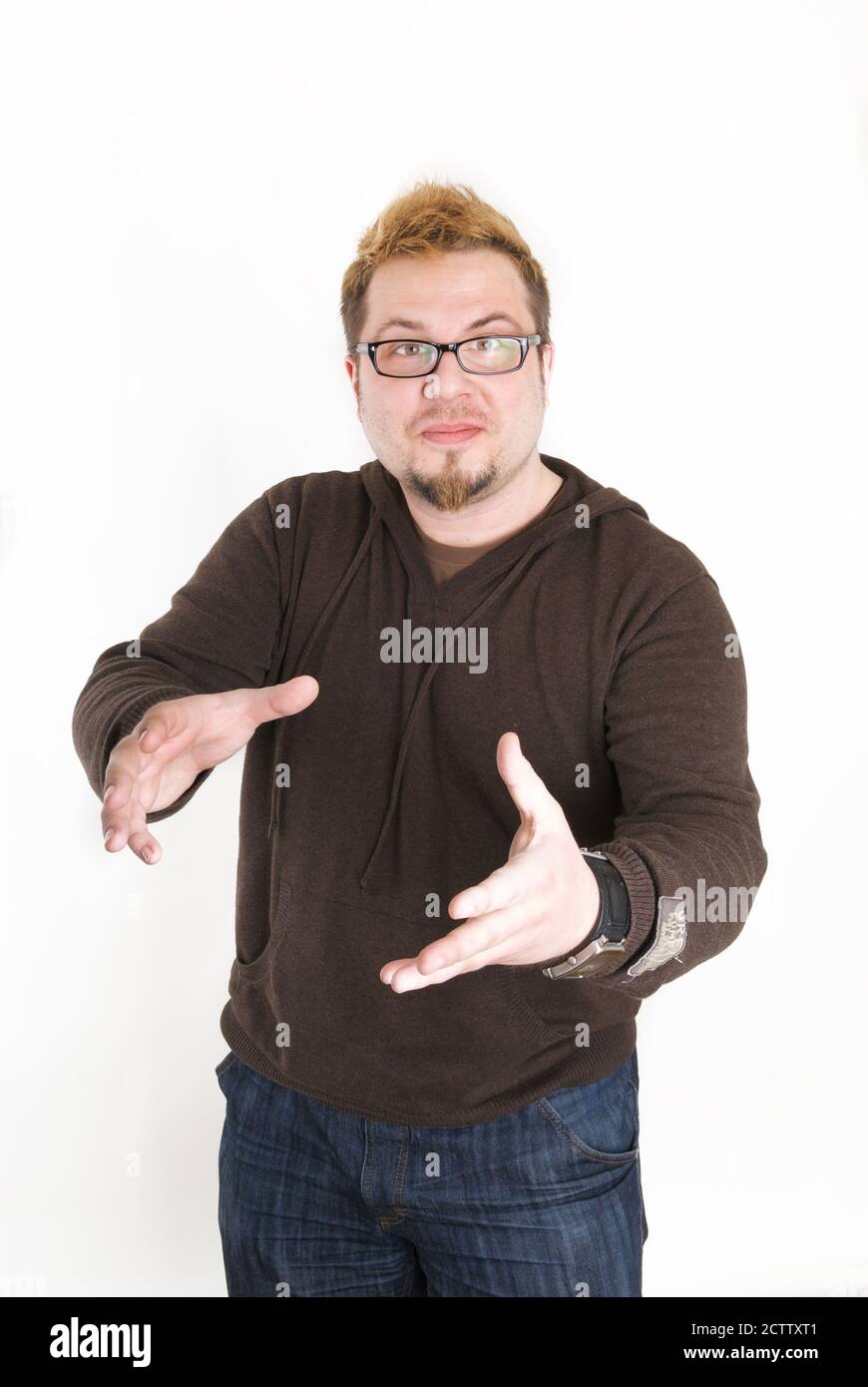 Perplexed Man with Glasses and Brown Sweatshirt Stock Photo - Alamy