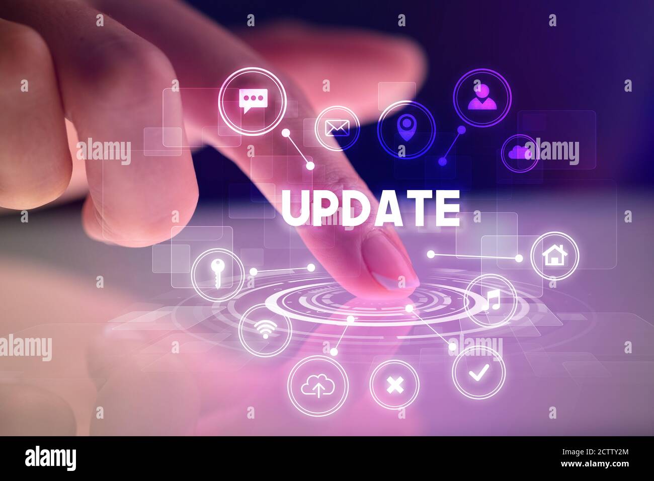 Finger touching tablet with web technology icons and UPDATE inscription ...
