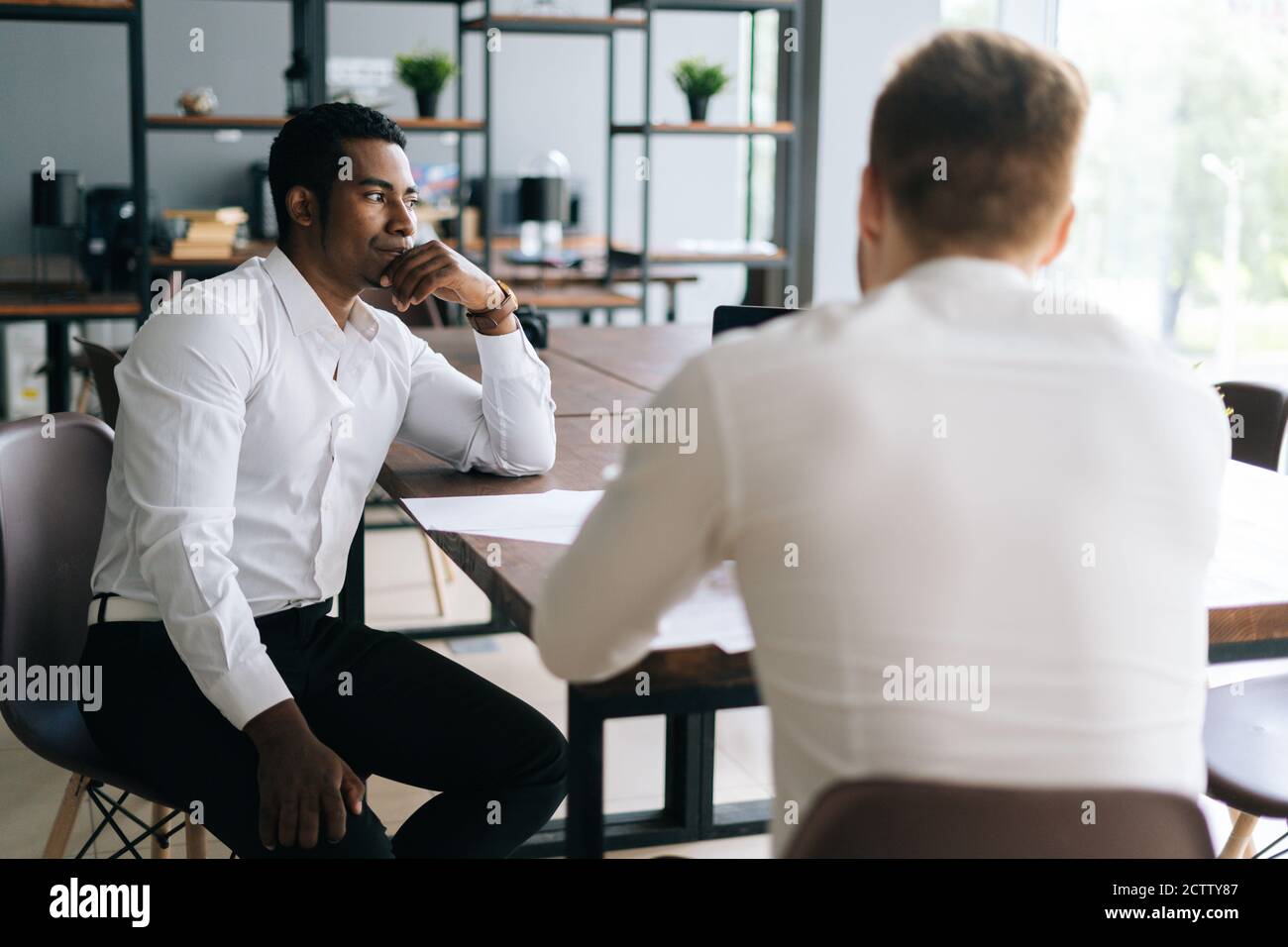 Two person interviewing ethnic hi-res stock photography and images - Alamy